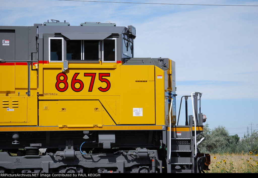 Side shot of the Very Brand New UP 8675's cab and her New Upper Housing Antenna Housing above ...